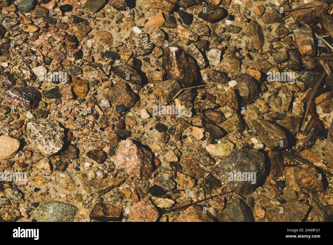 Shiny transparent water. clear water with pebbles and stone on the ...