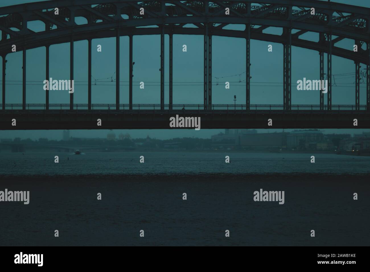 Water in rainy day with part of a bridge. rain falling on the river ...