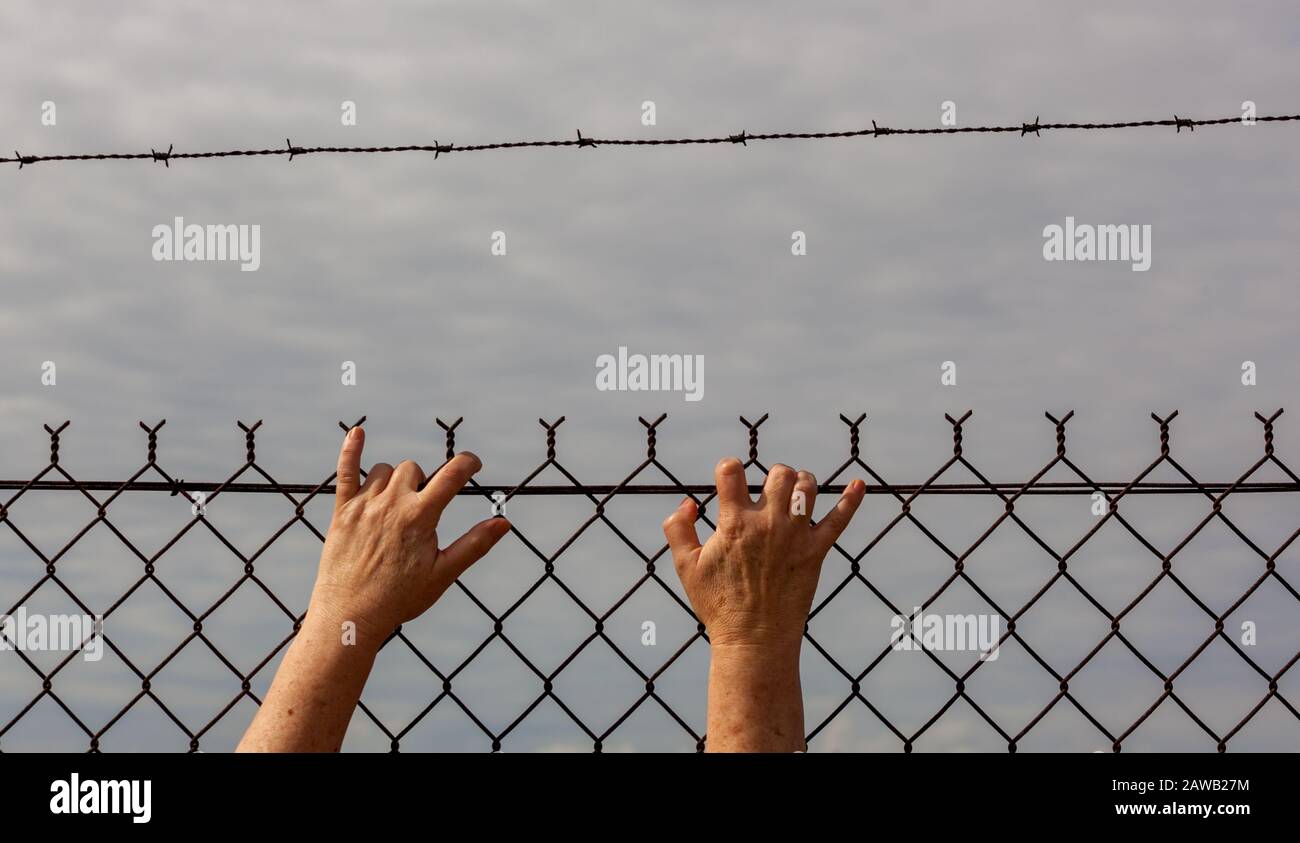 symbol of oppression barbed wire fence Stock Photo - Alamy