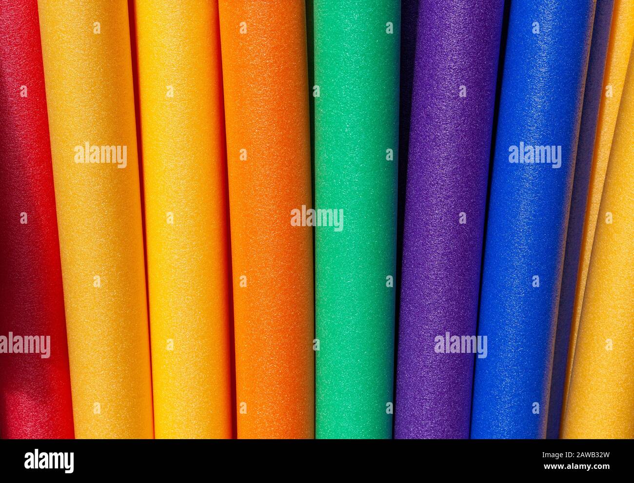 colorful pool noodles as background of rainbow colors Stock Photo - Alamy