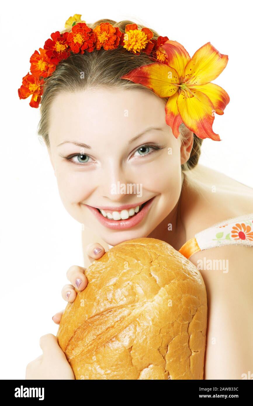 Picture of the smiling girl with a great bread Stock Photo - Alamy
