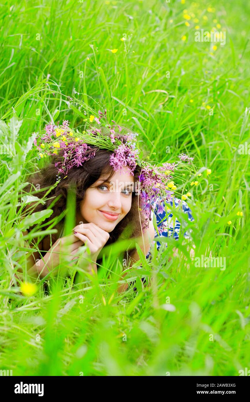 The image of a beautiful girl, lying on the grass field Stock Photo - Alamy