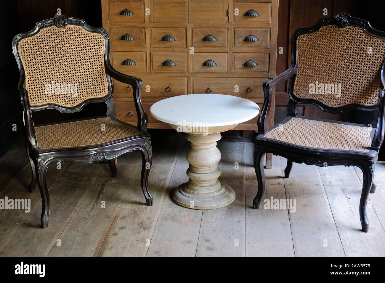 wicker rattan chair & old vintage retro drawer cabinet in living room ...