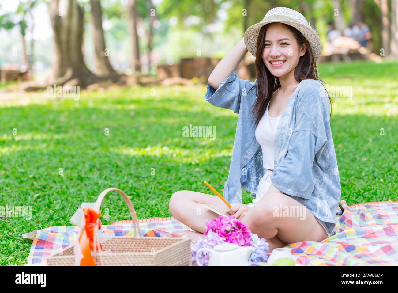 Beautiful single women girl teen enjoy relax holiday picnic outdoor at green park alone Stock ...