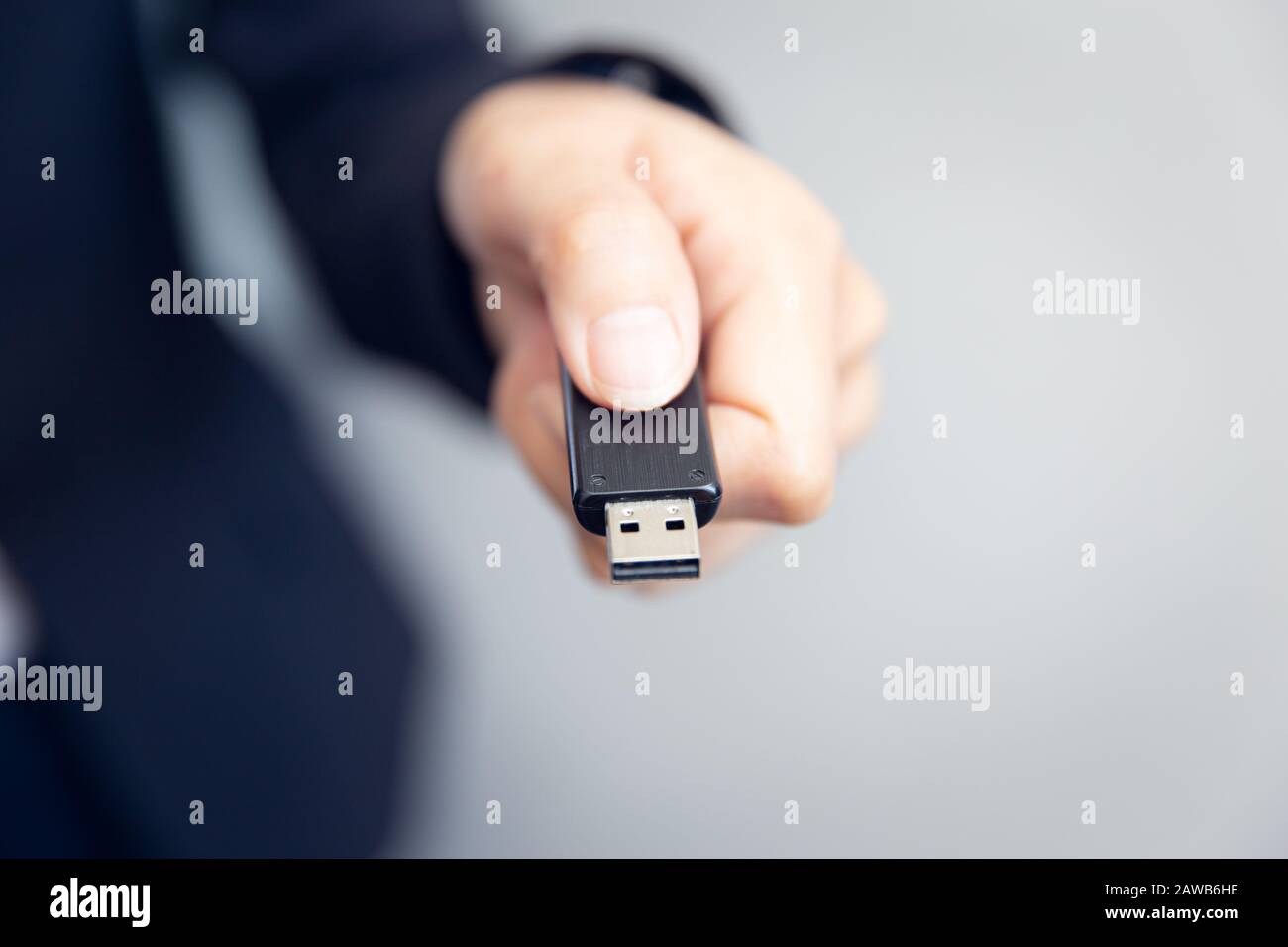 Closeup user hand plug insert USB flash drive type A male device Stock ...