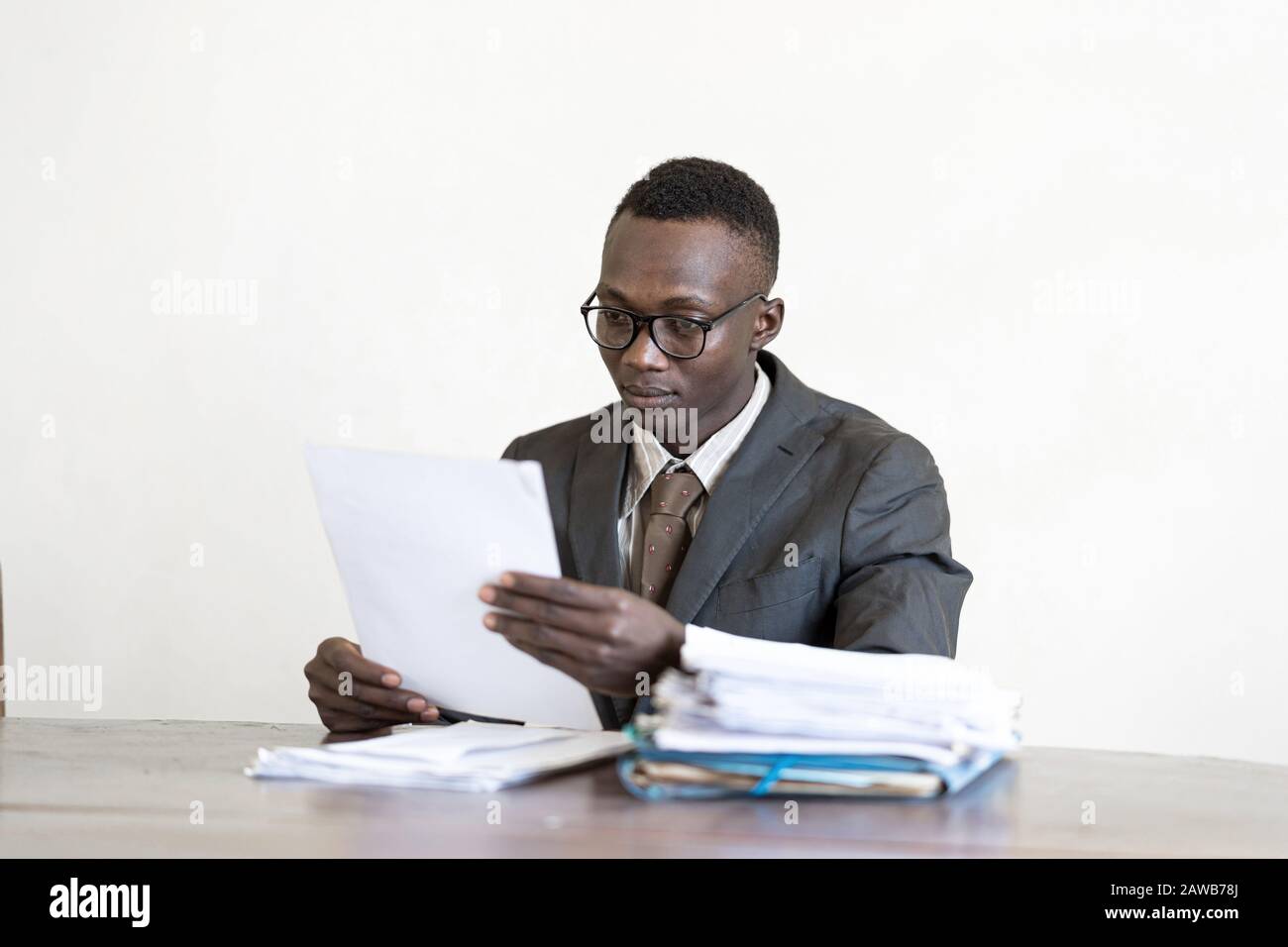 Candid young human working executive working hard Stock Photo - Alamy