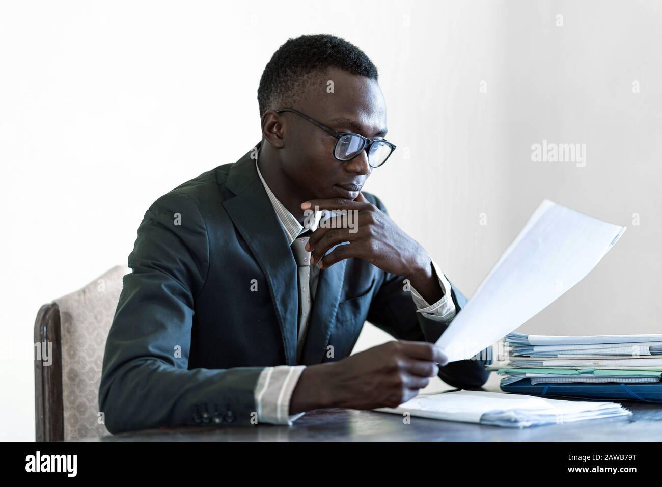 Black skinned confident guy posing employee has success at work Stock ...