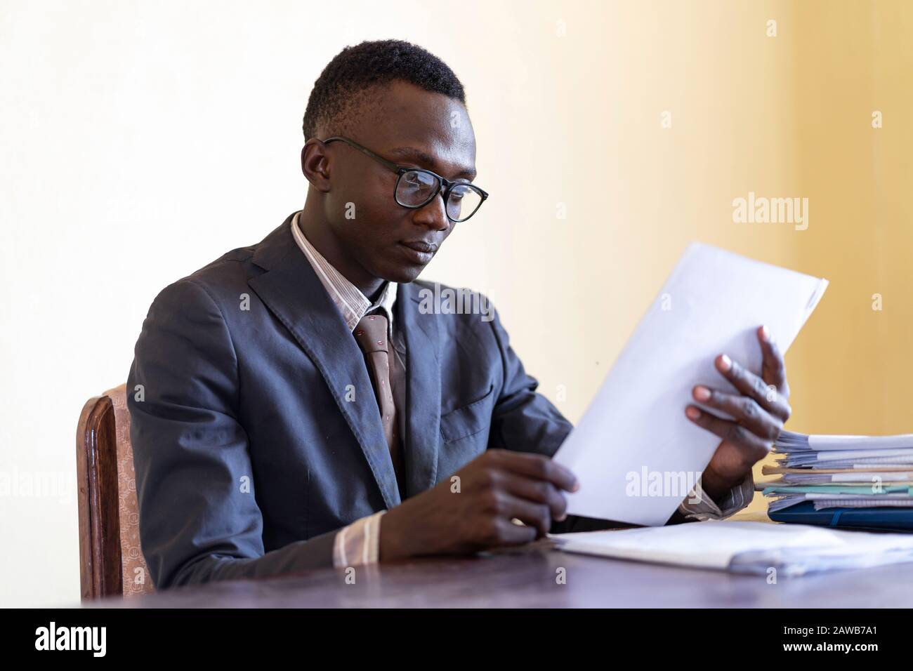 African ethnicity clever man at work boss busy Stock Photo - Alamy