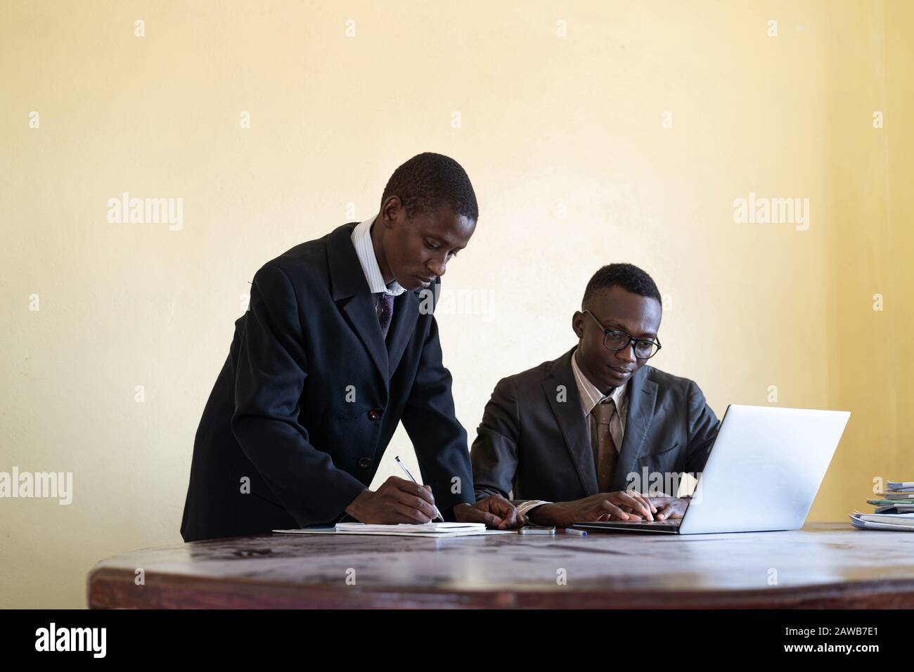 Two Real African Black Businessmen Working Together Stock Photo - Alamy
