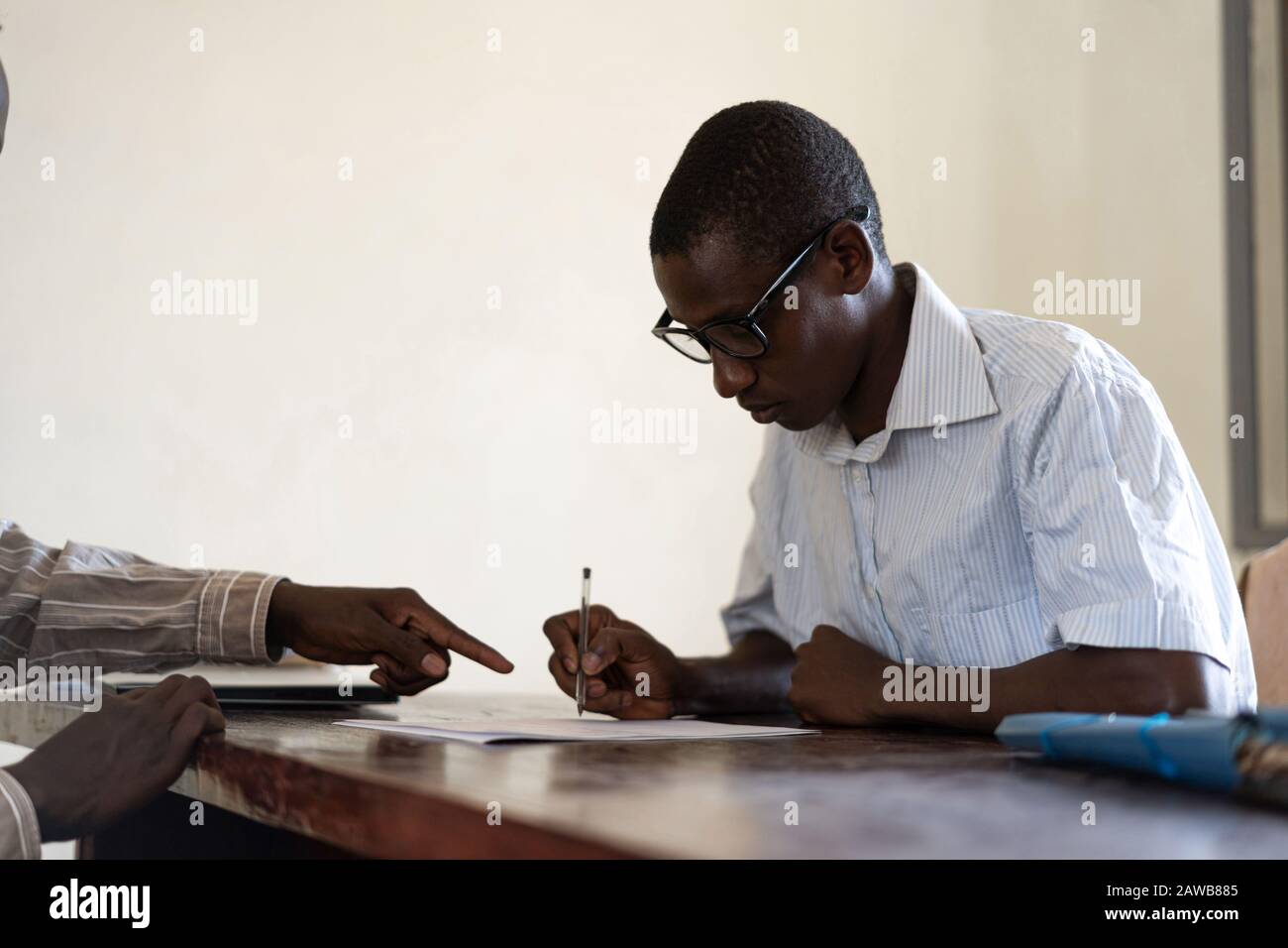 Handsome Young African Business People Signing a contract for a new job ...
