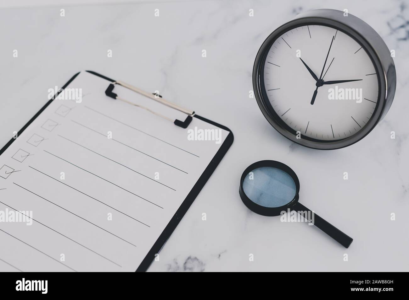 concept of productivity and deadlines, to do list on clipboard next to ...