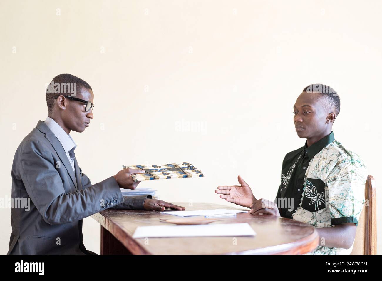 African black man receiving documents from a state official in his ...