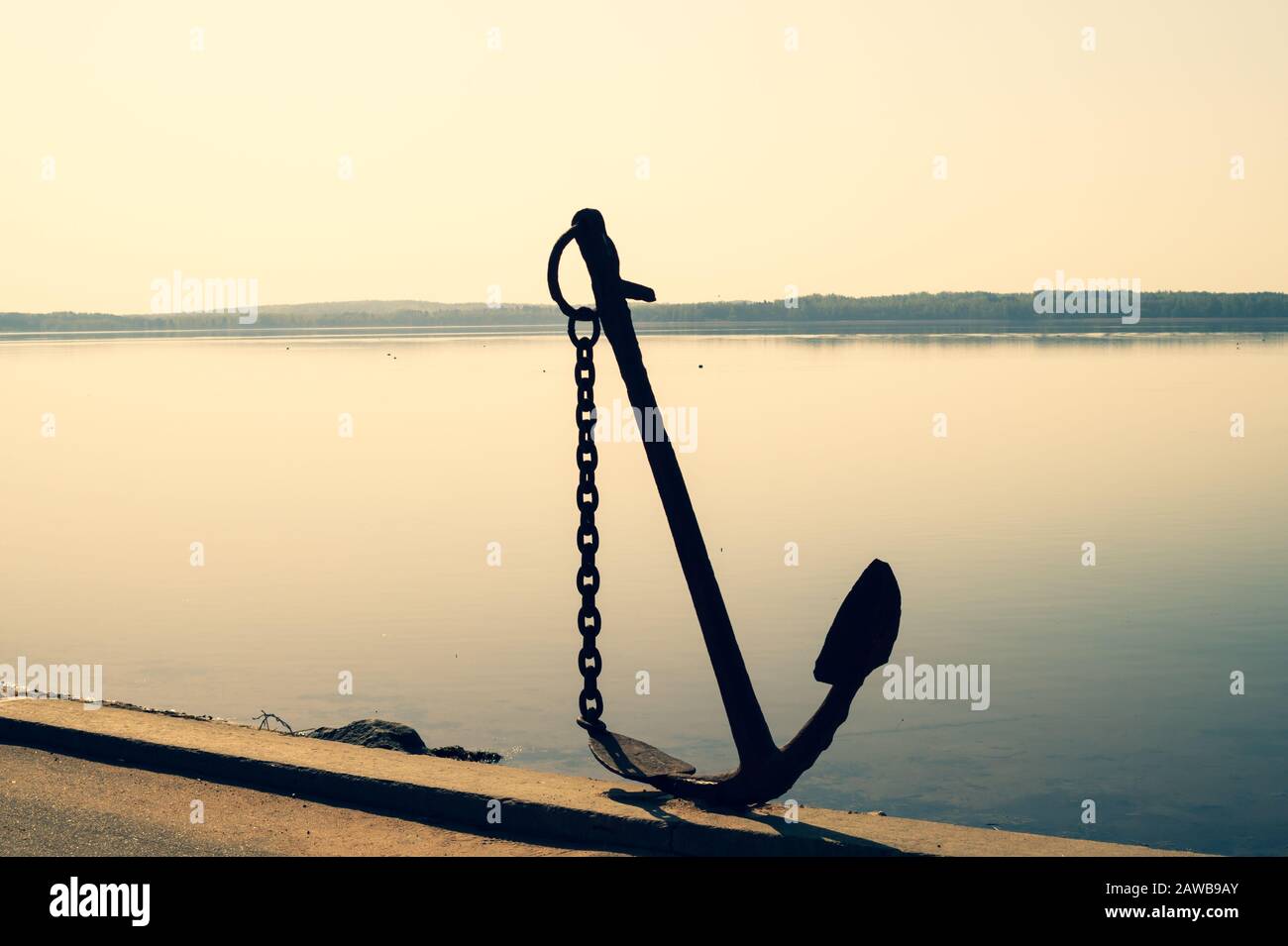 Anchor on the shore. anchor stands on the pier. marine background Stock ...