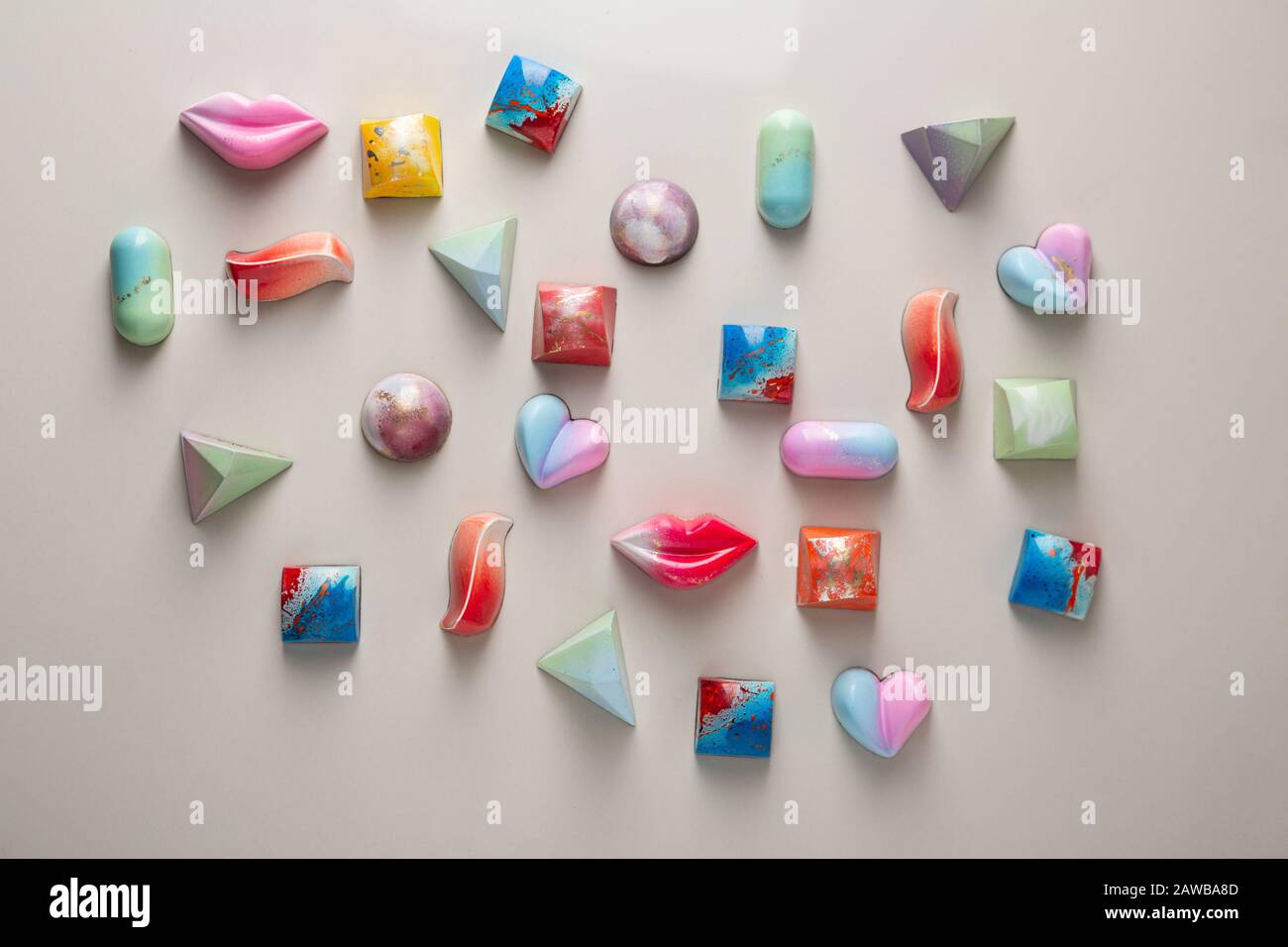 Modern chocolate candies on light surface Stock Photo - Alamy