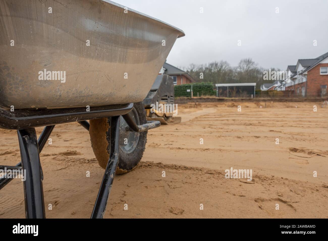 on a building site a wheelbarrow stands on levelled gravel Stock Photo ...