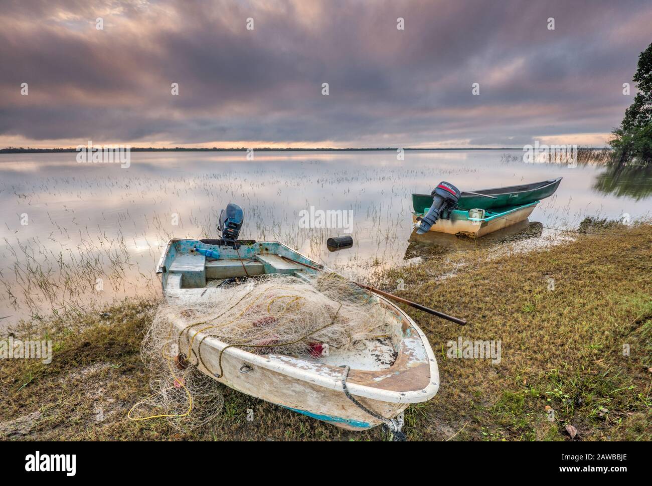 Boats at Northern Lagoon shore at sunrise, Bird's Eye View Lodge ...