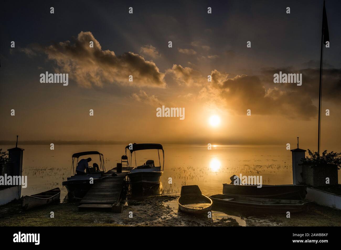 Boats moored at boardwalk at Bird's Eye View Lodge over Northern Lagoon ...