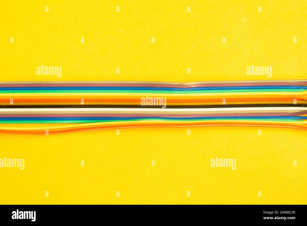Colorful wires isolated on yellow background. connection wire for ...