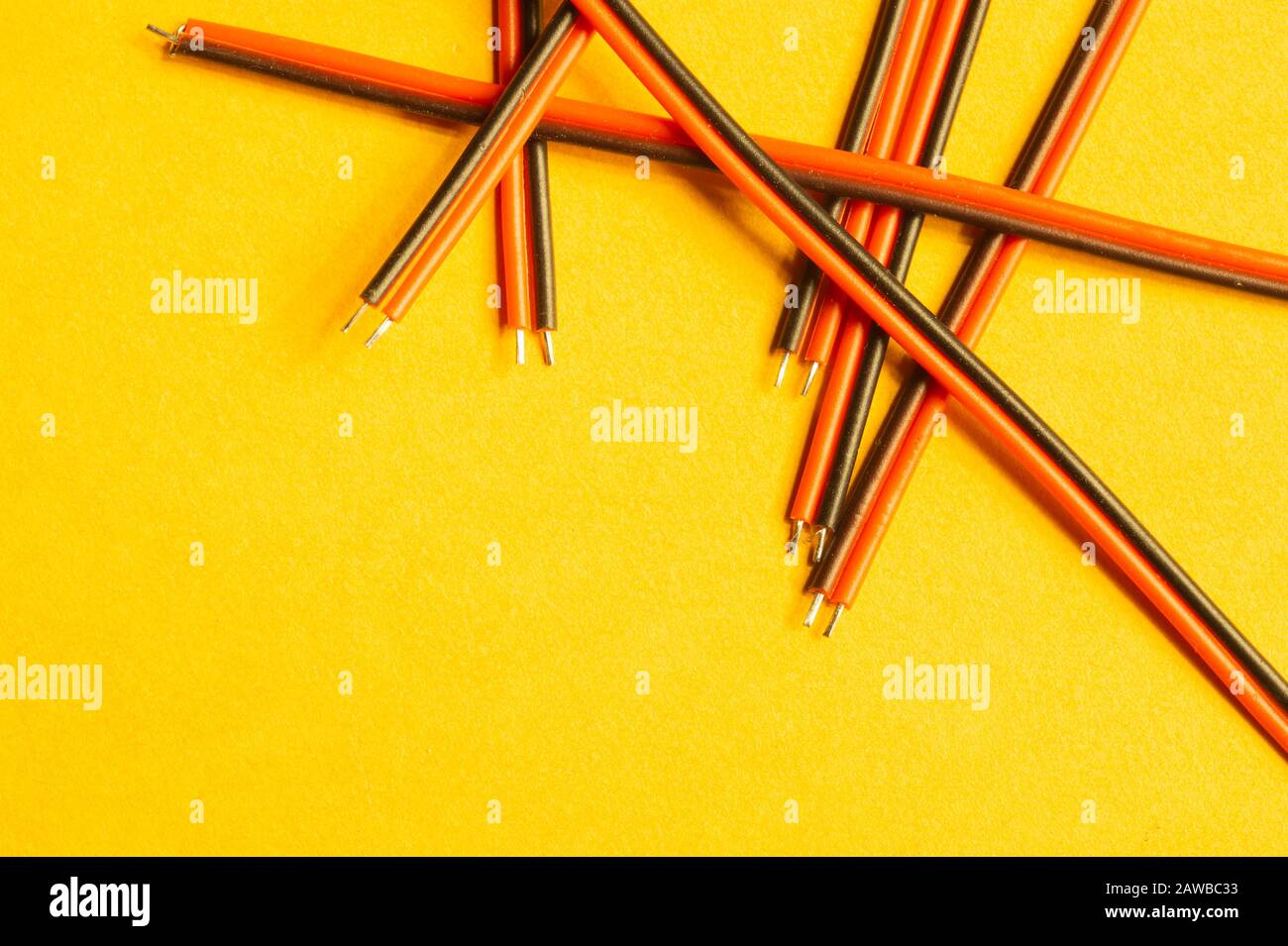 Colorful wires isolated on yellow background. connection wire for ...