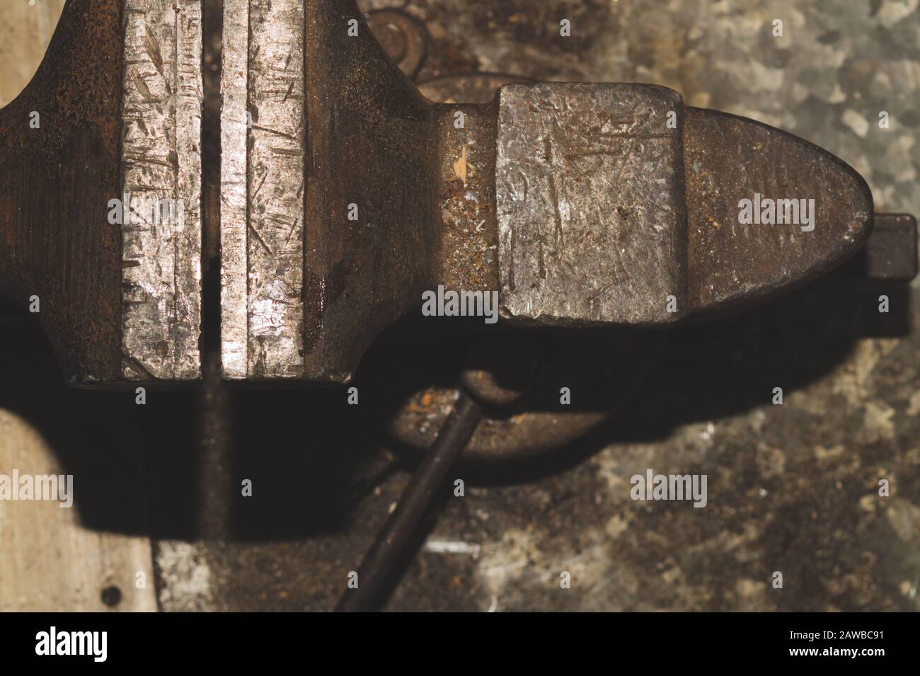 Old bench vise on a metal workbench. work tool Stock Photo - Alamy