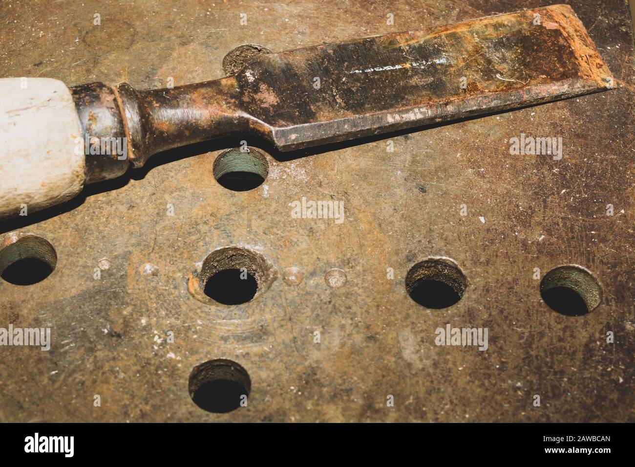 Old chisel on the metal workbench. woodworking tool. instrument for ...