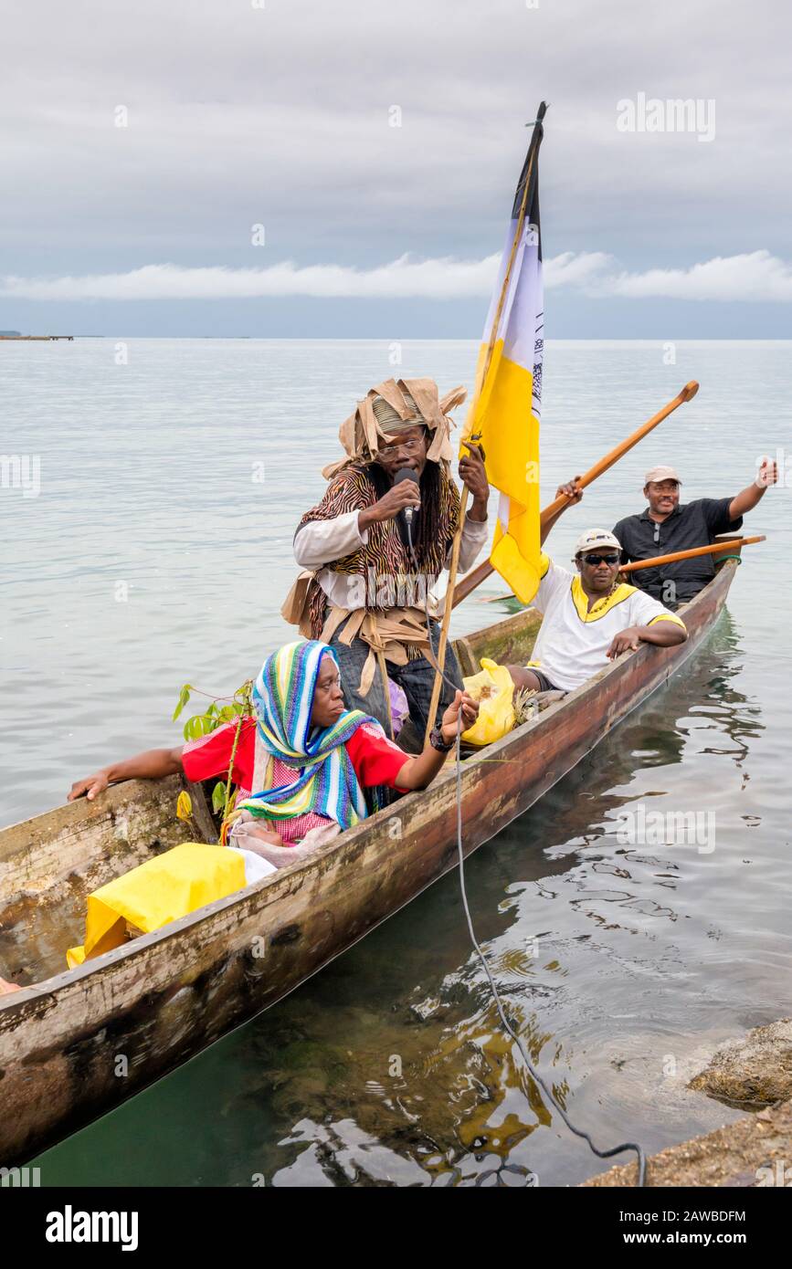 Garifuna people arriving in a canoe, celebrating on Garifuna Settlement ...