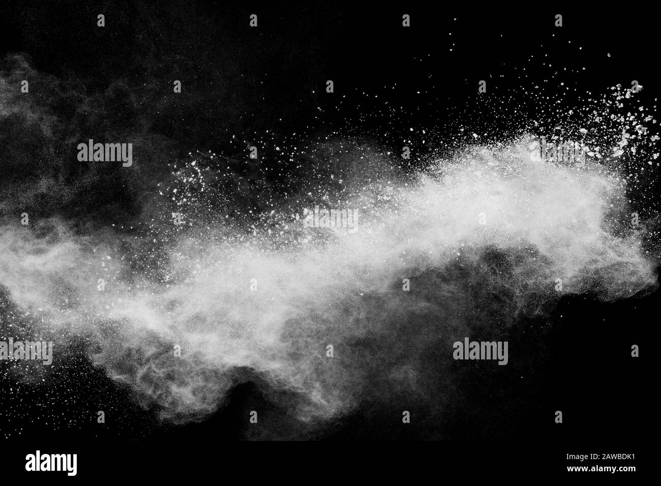 Freeze motion of white dust particles splash on black background.White ...