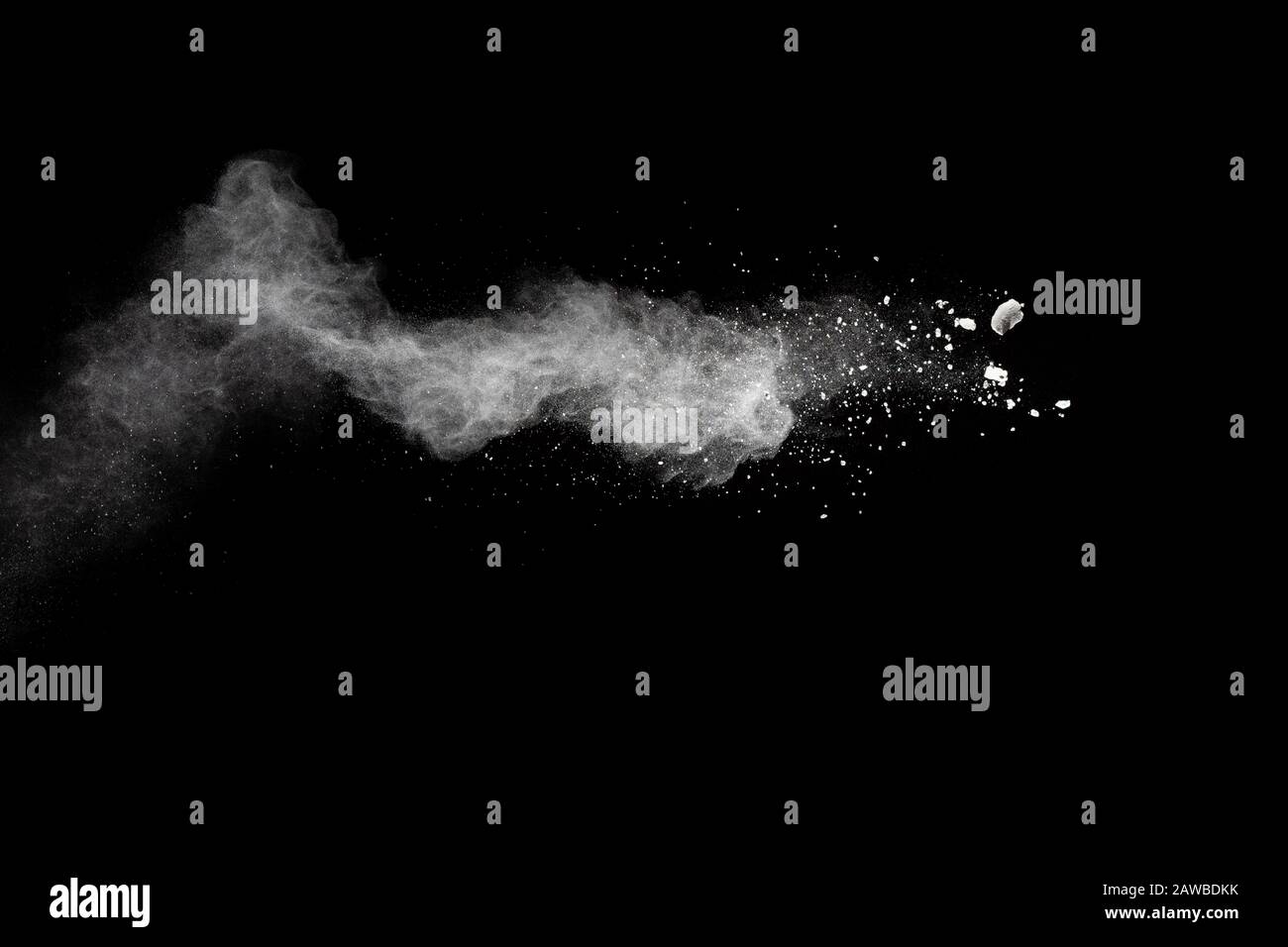 Freeze motion of white dust particles splash on black background.White ...