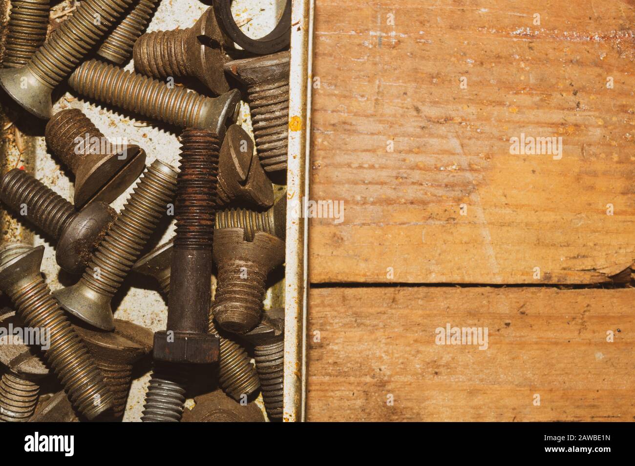 Old screws in a box. a lot of various screws. pile of fasteners in the ...