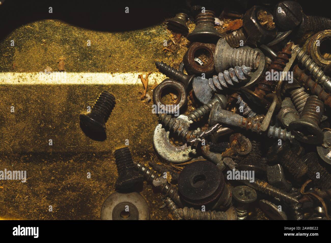 Old screws in a box. a lot of various screws. pile of fasteners in the ...