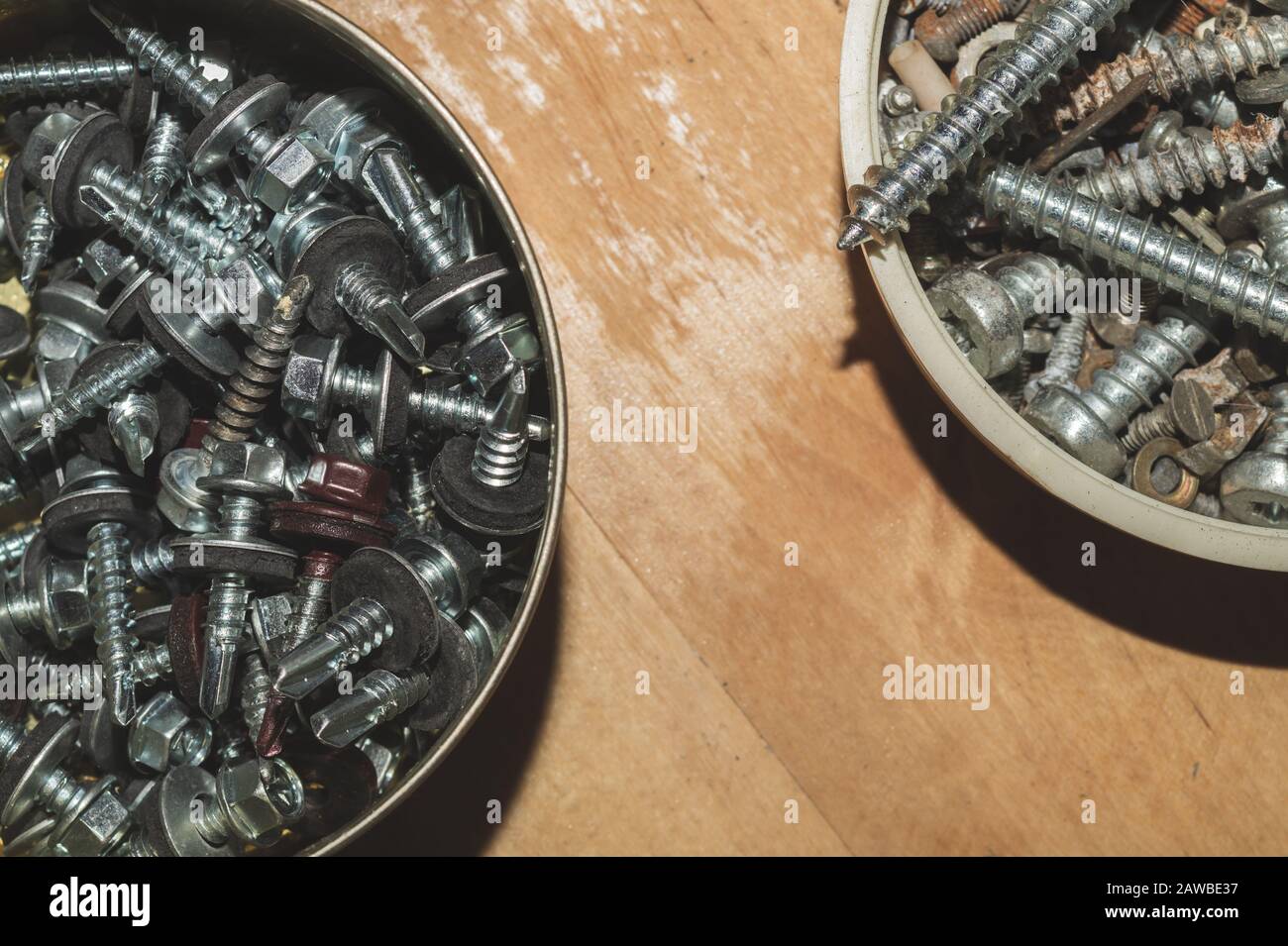 Old screws in a box. a lot of various screws. pile of fasteners in the ...