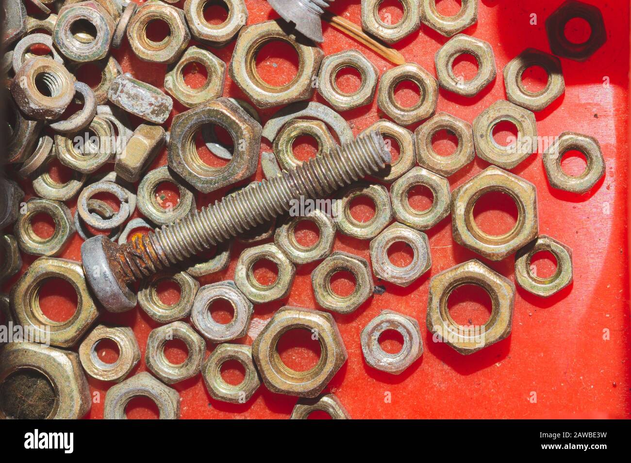 Old screws in a box. a lot of various screws. pile of fasteners in the ...