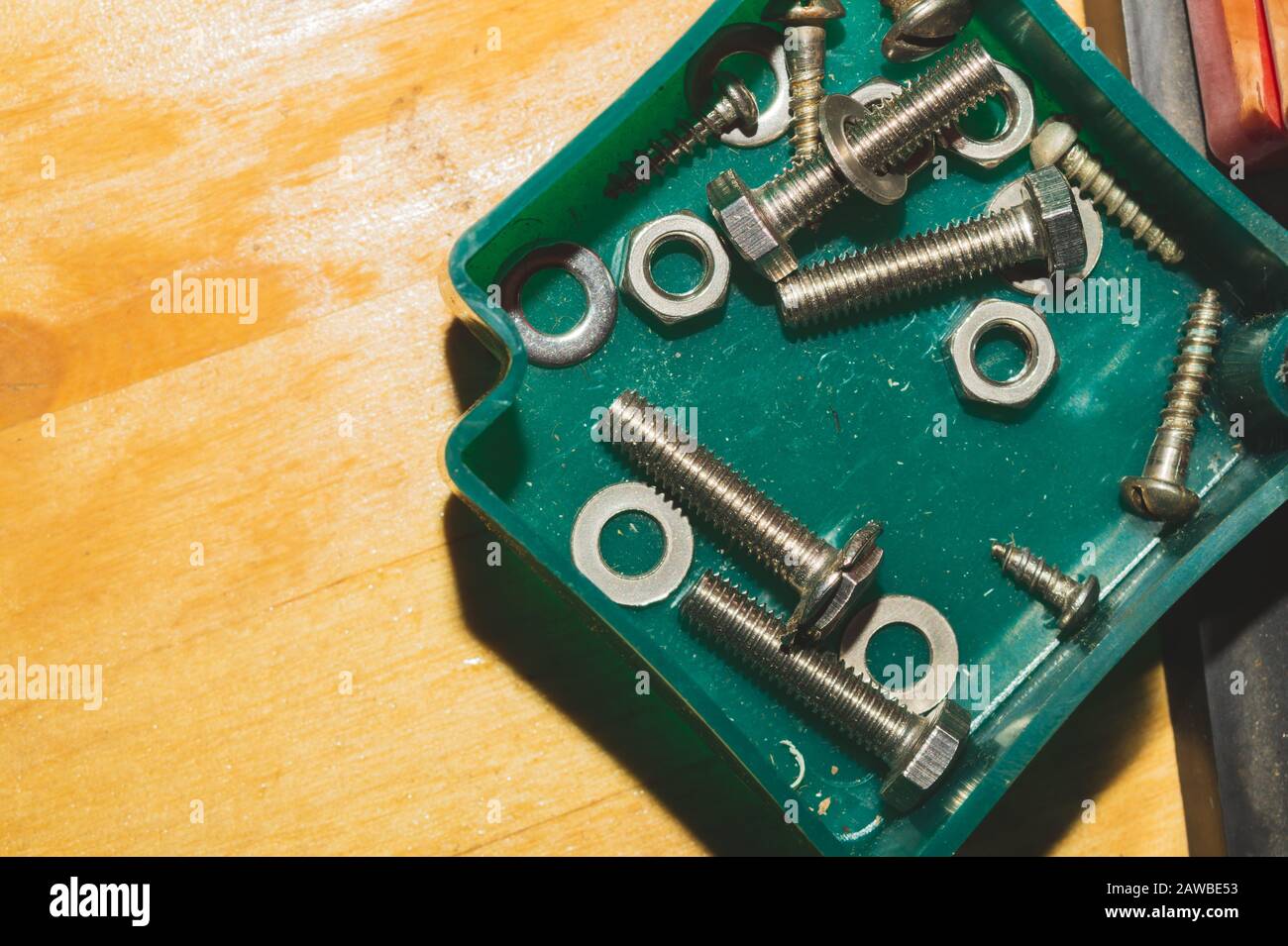 Old screws in a box. a lot of various screws. pile of fasteners in the ...