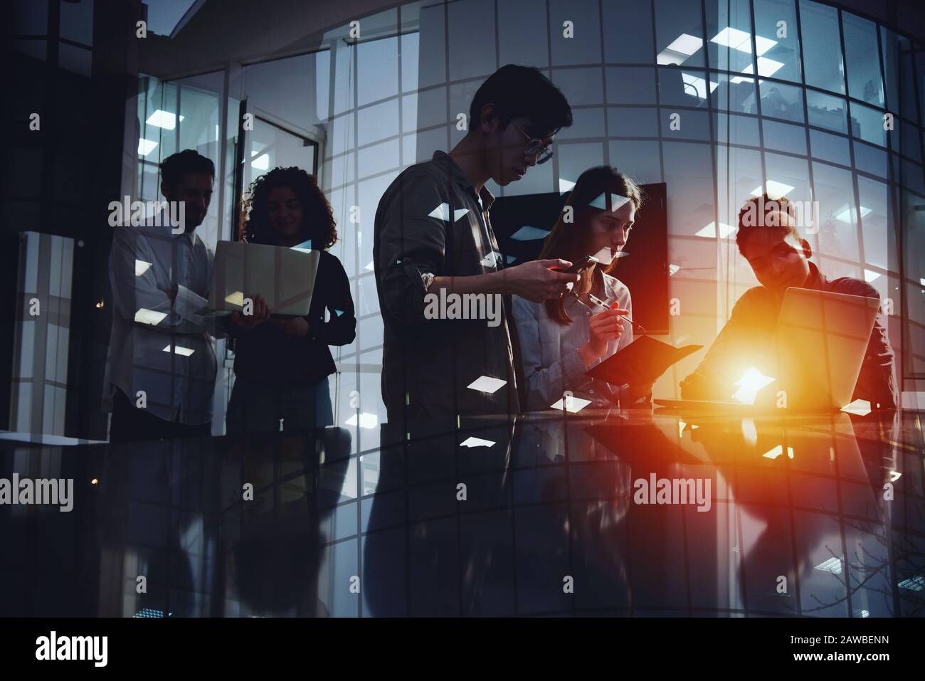 Businessmen that work together in office with network connection effect ...