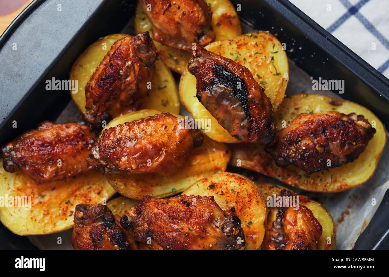 Baked chicken wings on potatoesBaked chicken wings on potatoes Stock ...