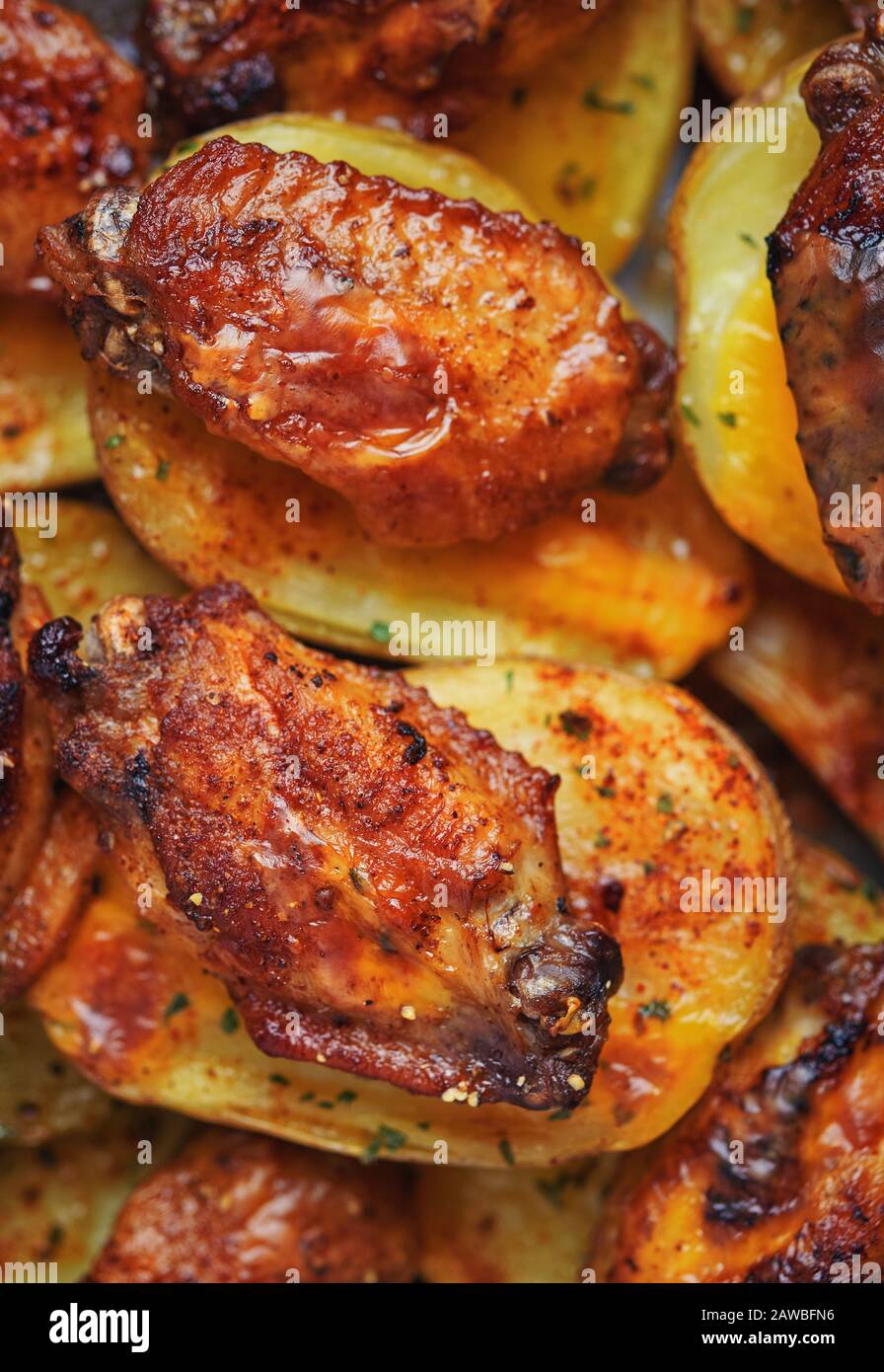 Baked chicken wings on potatoesBaked chicken wings on potatoes Stock ...