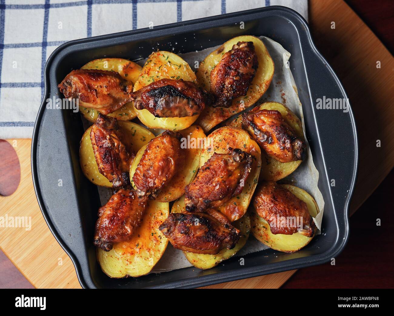 Baked chicken wings on potatoesBaked chicken wings on potatoes Stock ...