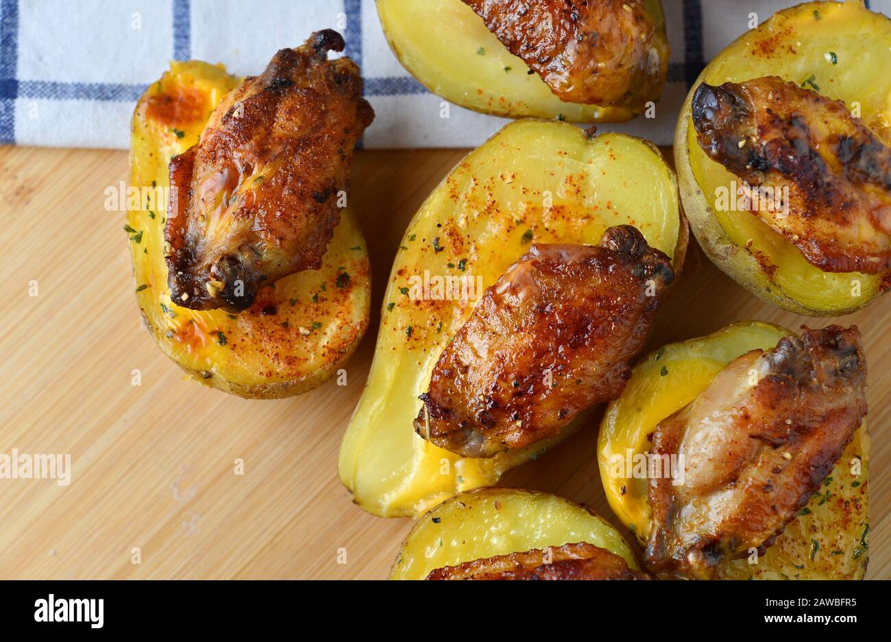 Baked chicken wings on potatoesBaked chicken wings on potatoes Stock ...