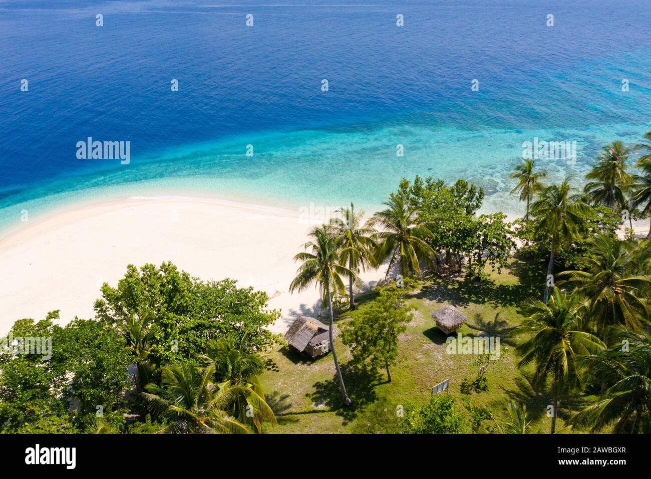 Beautiful lagoon and white sandy beach, aerial view.Tourist boat off ...