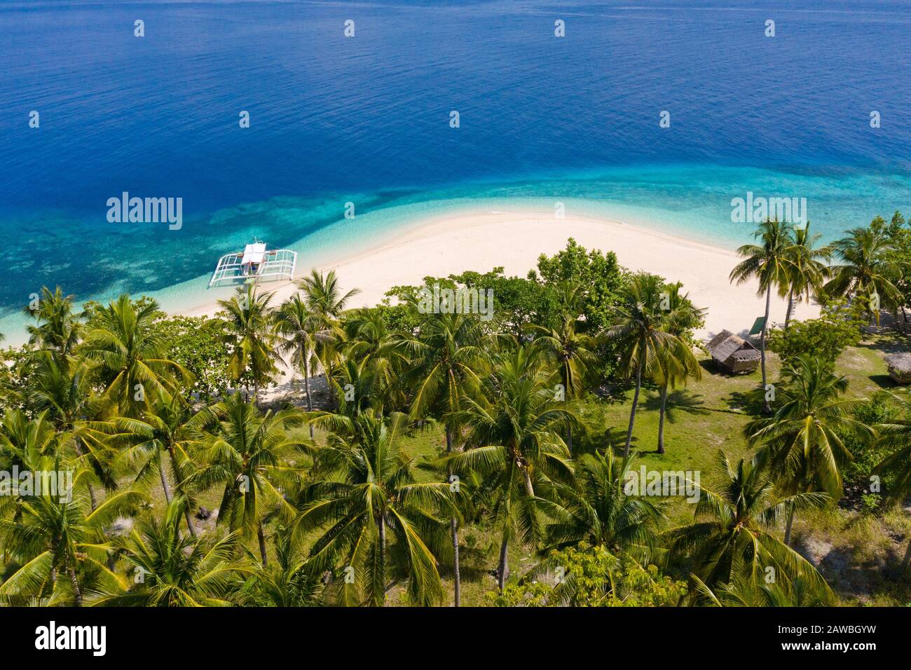 Beautiful lagoon and white sandy beach, aerial view.Tourist boat off ...