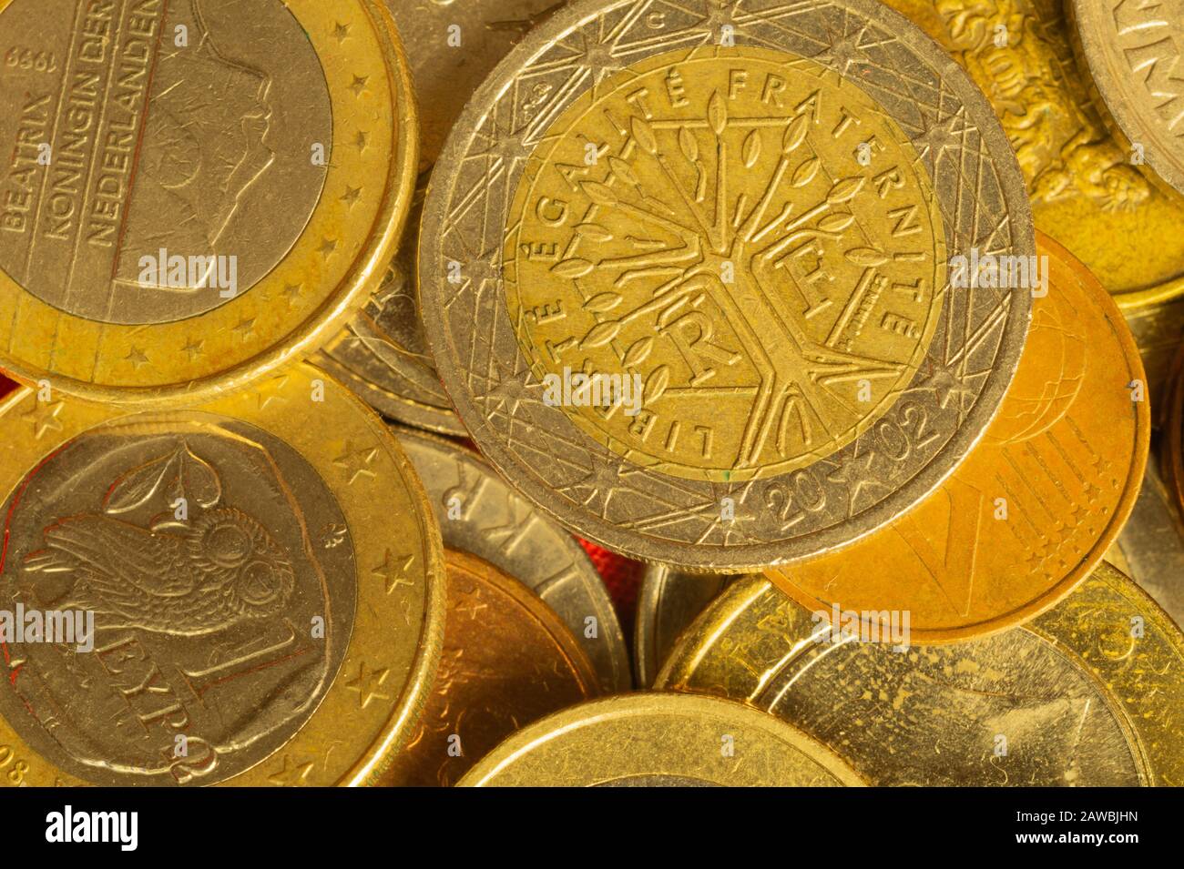 Coins of different countries. a lot of metal coins of different ...