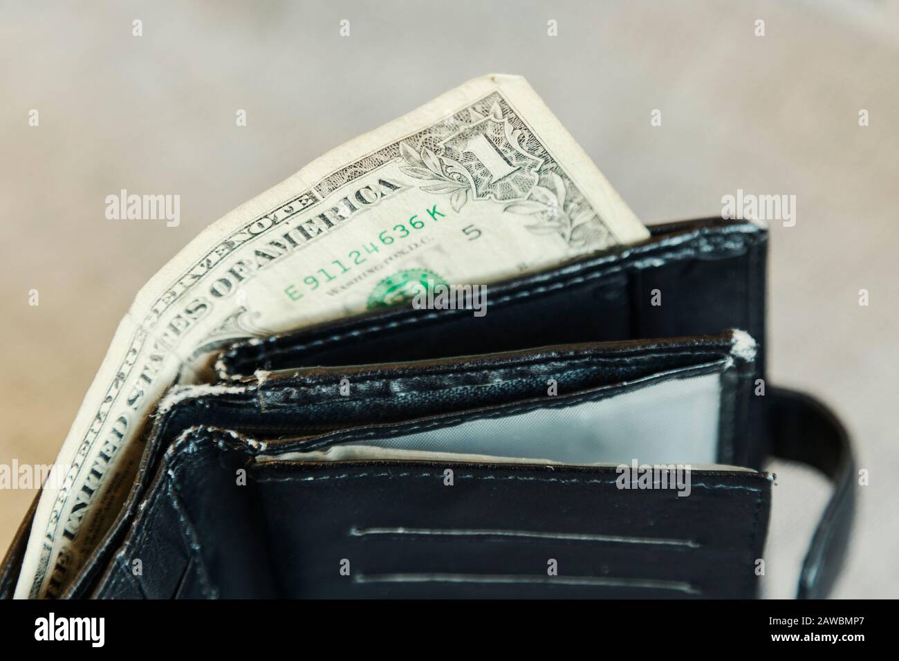 Empty male wallet with one dollar bill. financial wellness. copy space ...