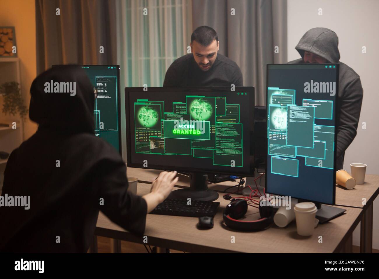 Excited female hacker after getting access granted after a cyber attack ...