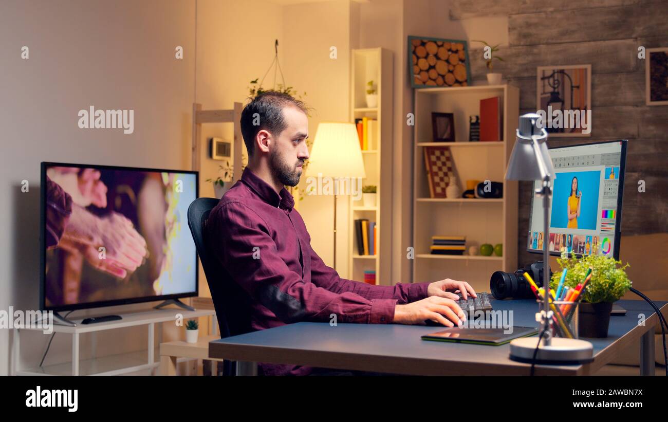 Professional photographer using pad for photo retouching. Creative ...