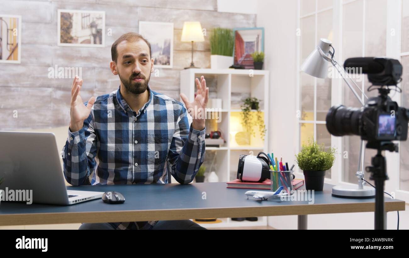 Famous young vlogger making a giveaway on his channel. Vlogger talking ...