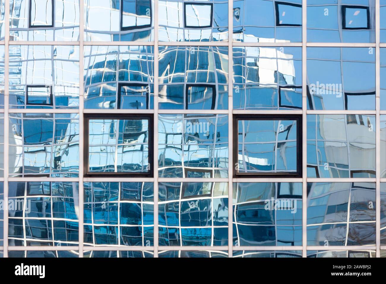 abstract patterns formed by reflections of architecture in windows of ...