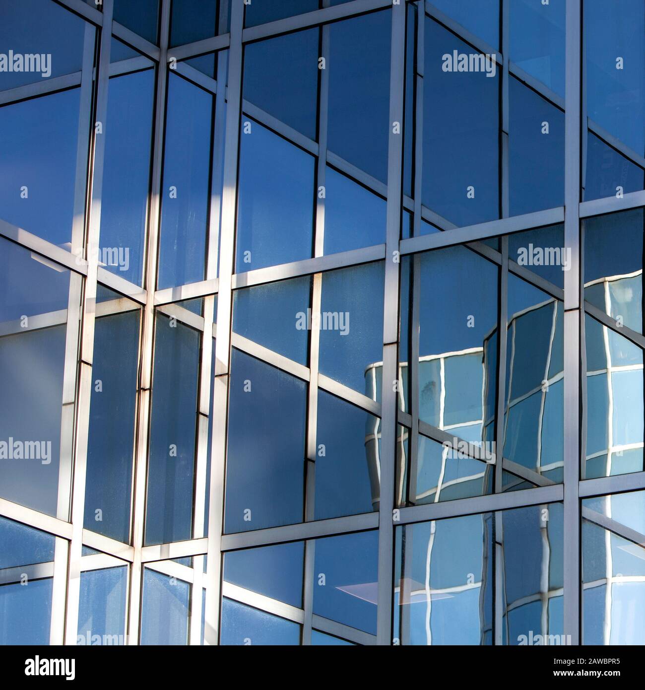abstract patterns formed by reflections of architecture in windows of ...