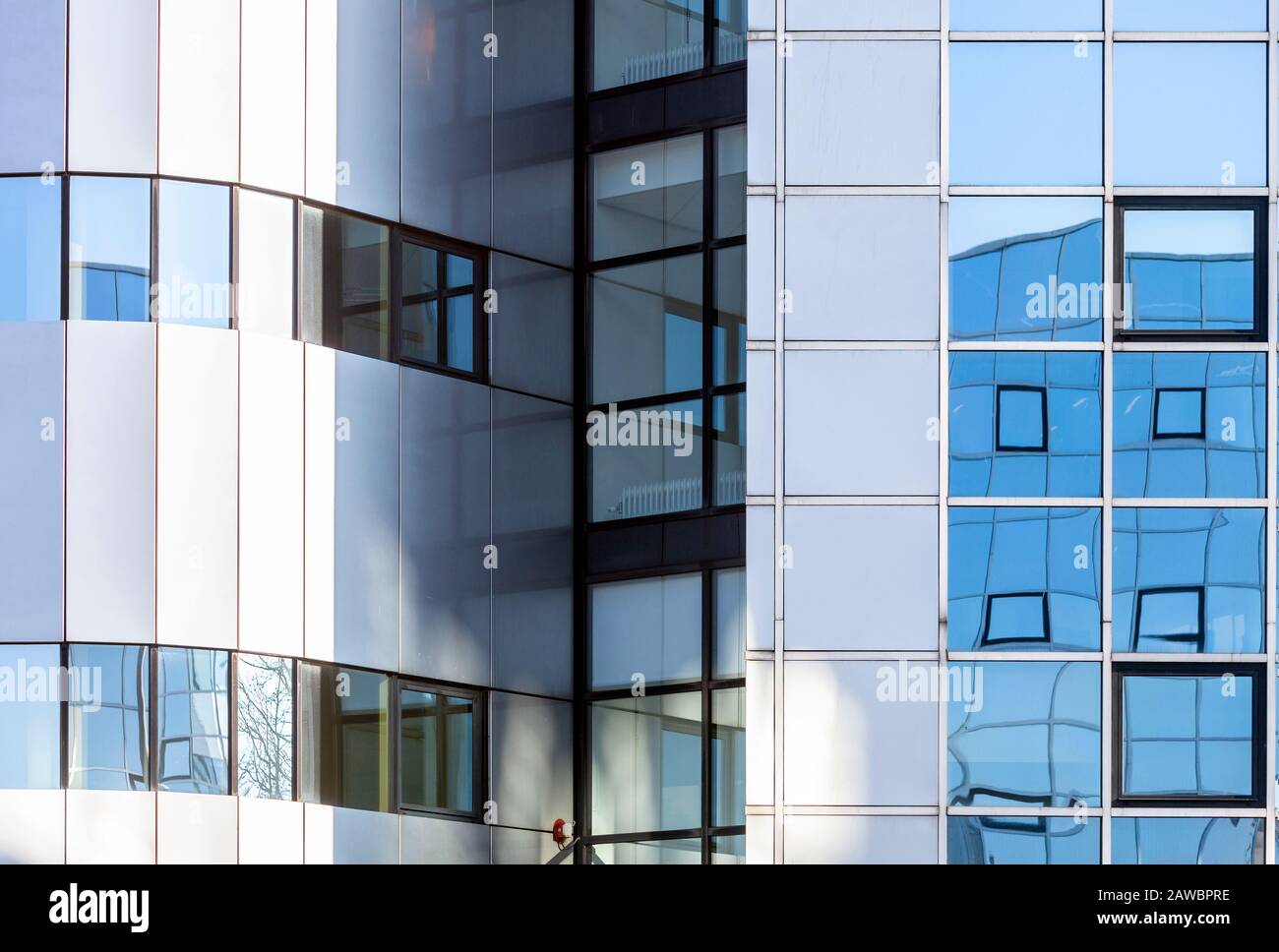 abstract patterns formed by reflections of architecture in windows of ...