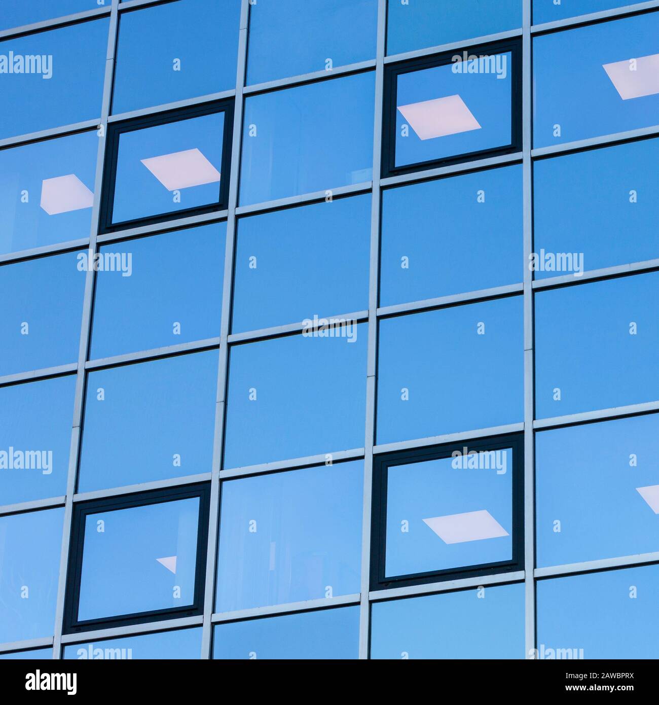 abstract patterns formed by reflections of architecture in windows of ...