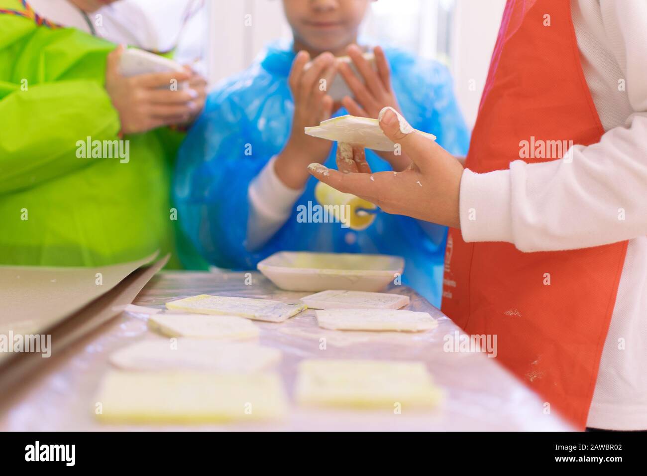Close-up of a children in art therapy class drawing, painting and ...